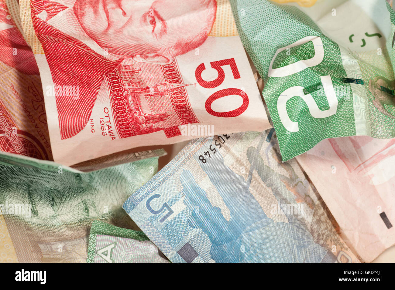 Crinkled Canadian dollar bills closeup Stock Photo - Alamy