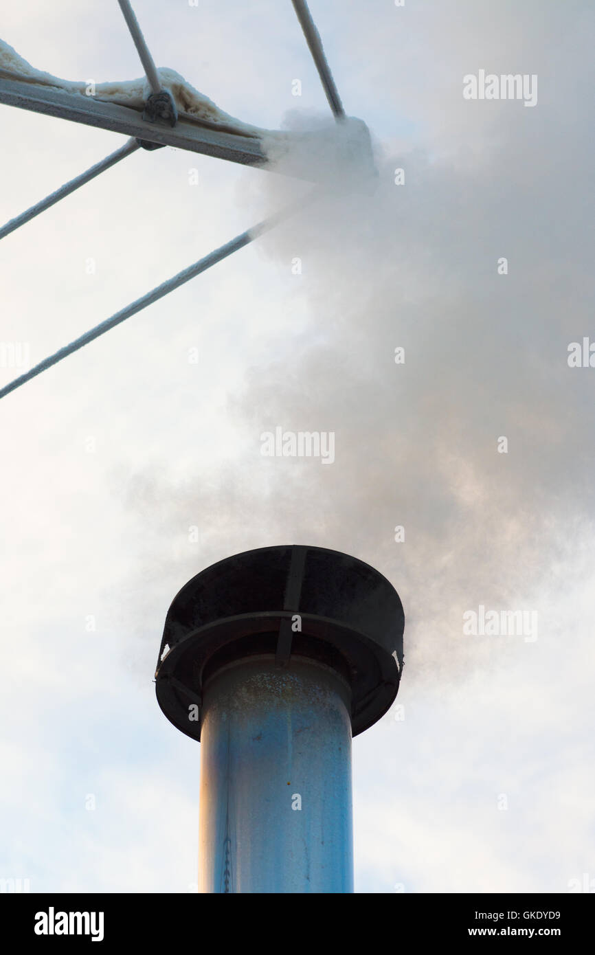 Smoking residential chimney Stock Photo - Alamy