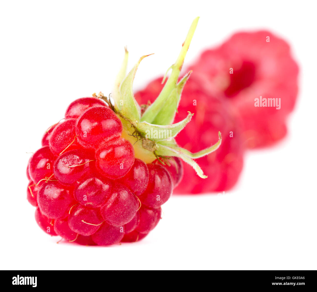 Raspberries on white background Stock Photo - Alamy
