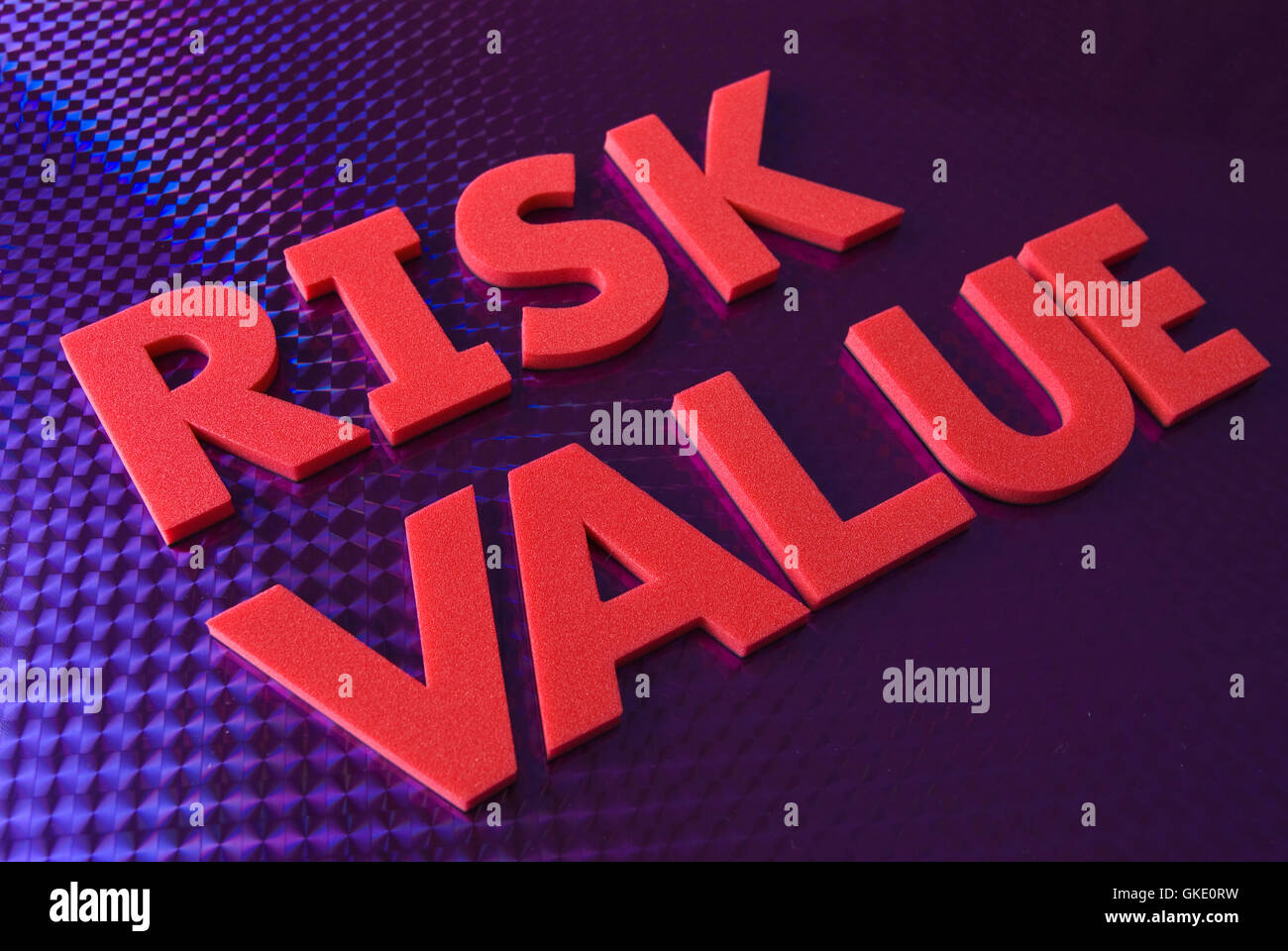 Risk value word on blue neon background Stock Photo - Alamy