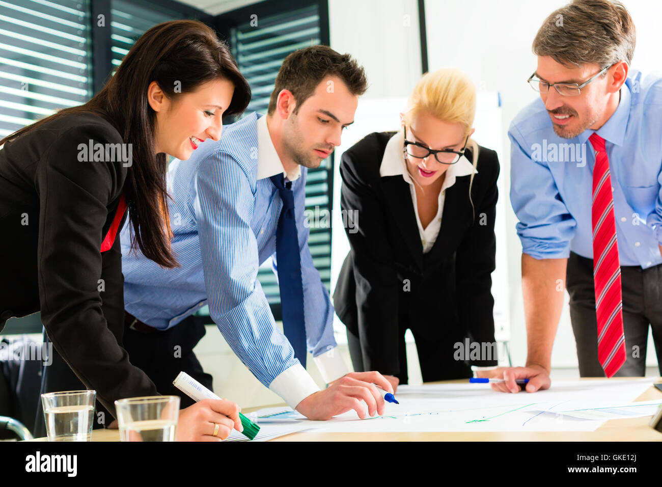 business - people in the office work as a team Stock Photo - Alamy