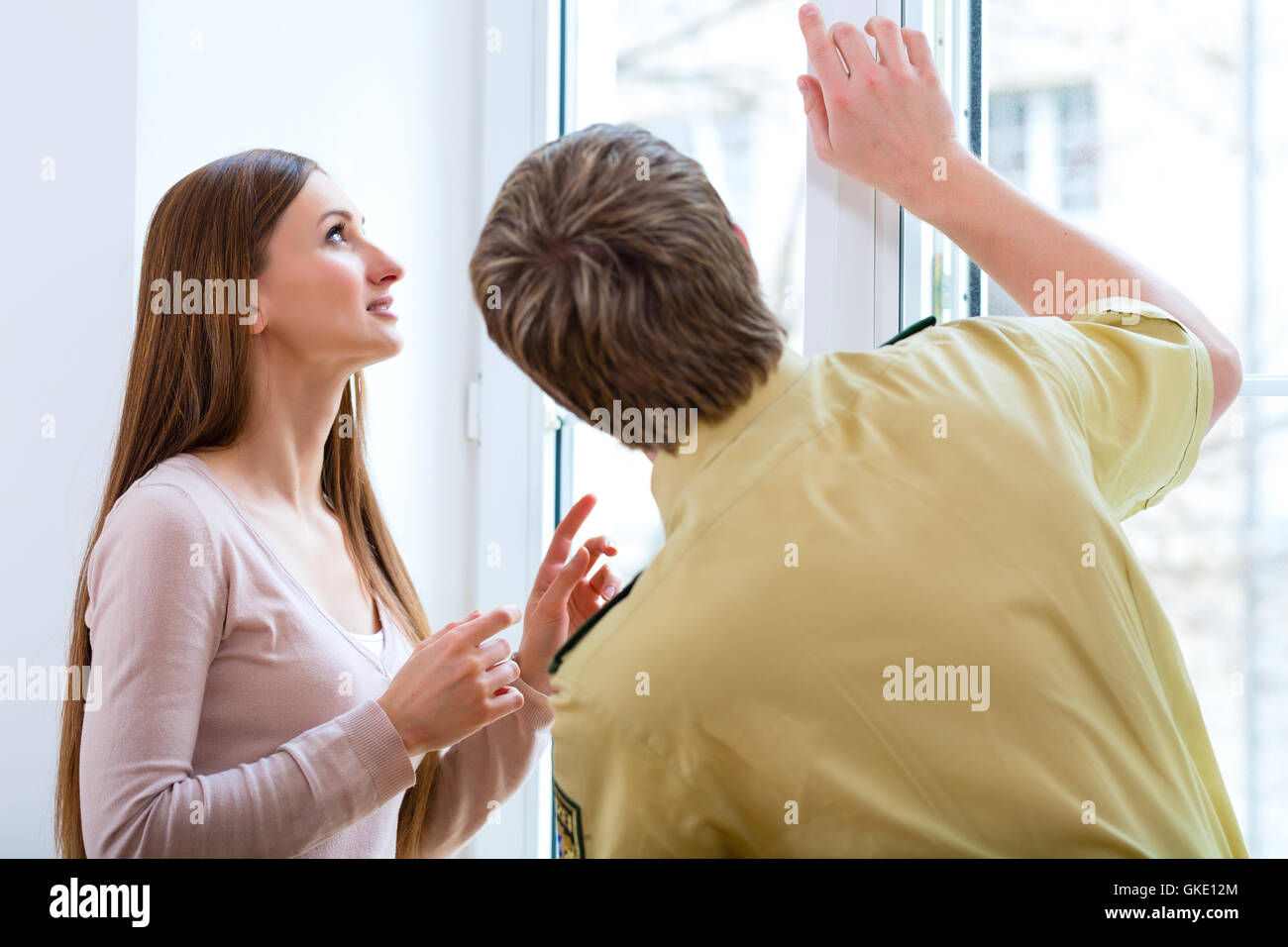 police in search for clues at the window of an apartment Stock Photo ...