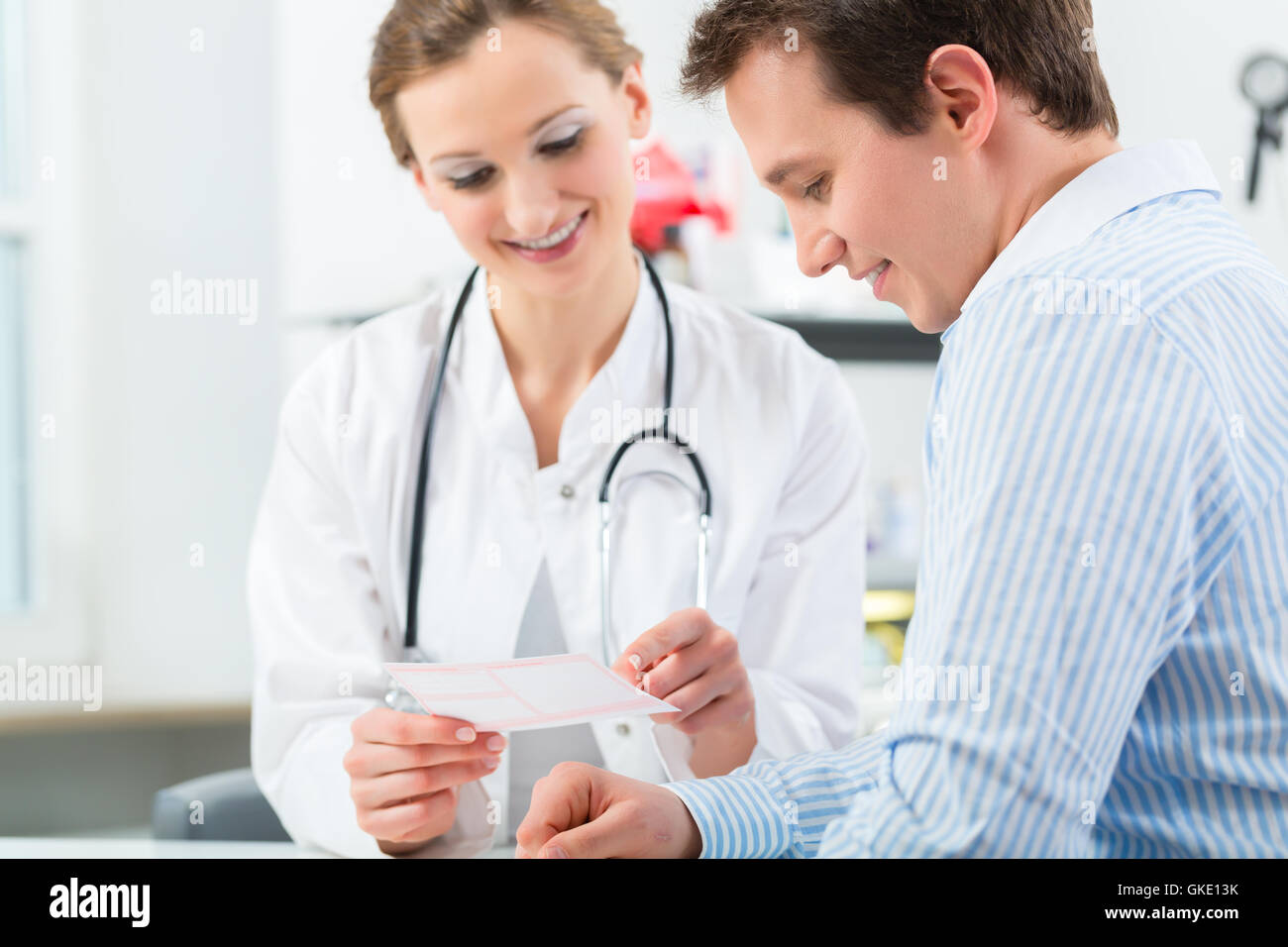 physicians with patient during counseling Stock Photo - Alamy