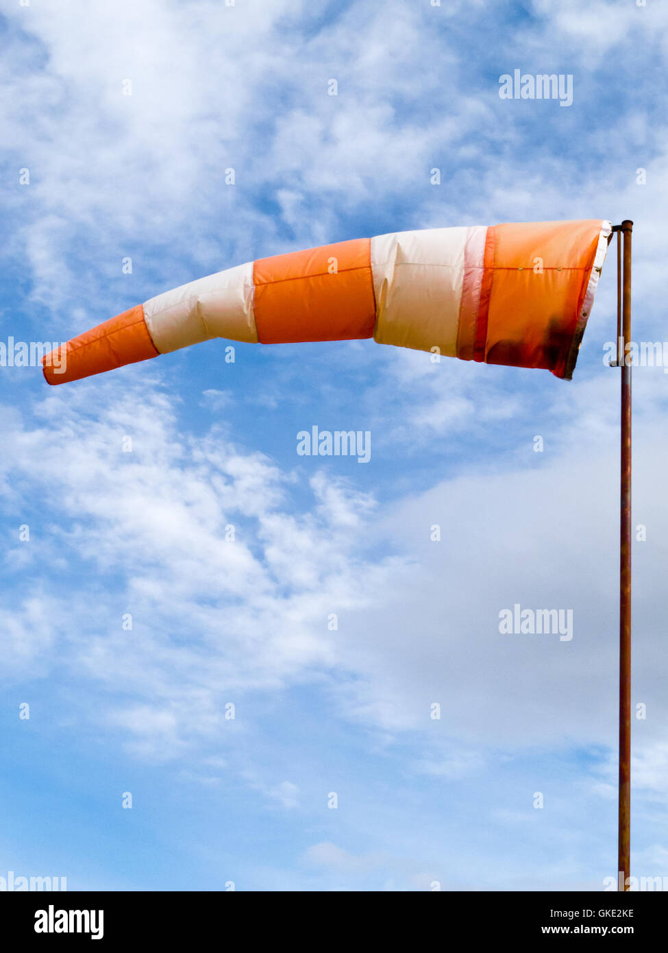 Full wind cone weather vane on windy day Stock Photo - Alamy