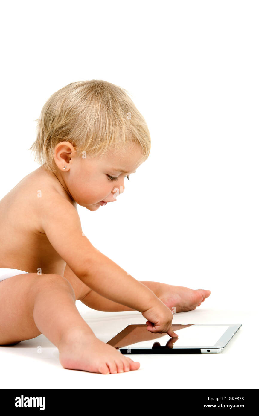 Baby girl with tablet on white background Stock Photo - Alamy
