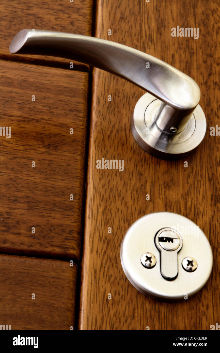 Handle and wooden door close up Stock Photo - Alamy