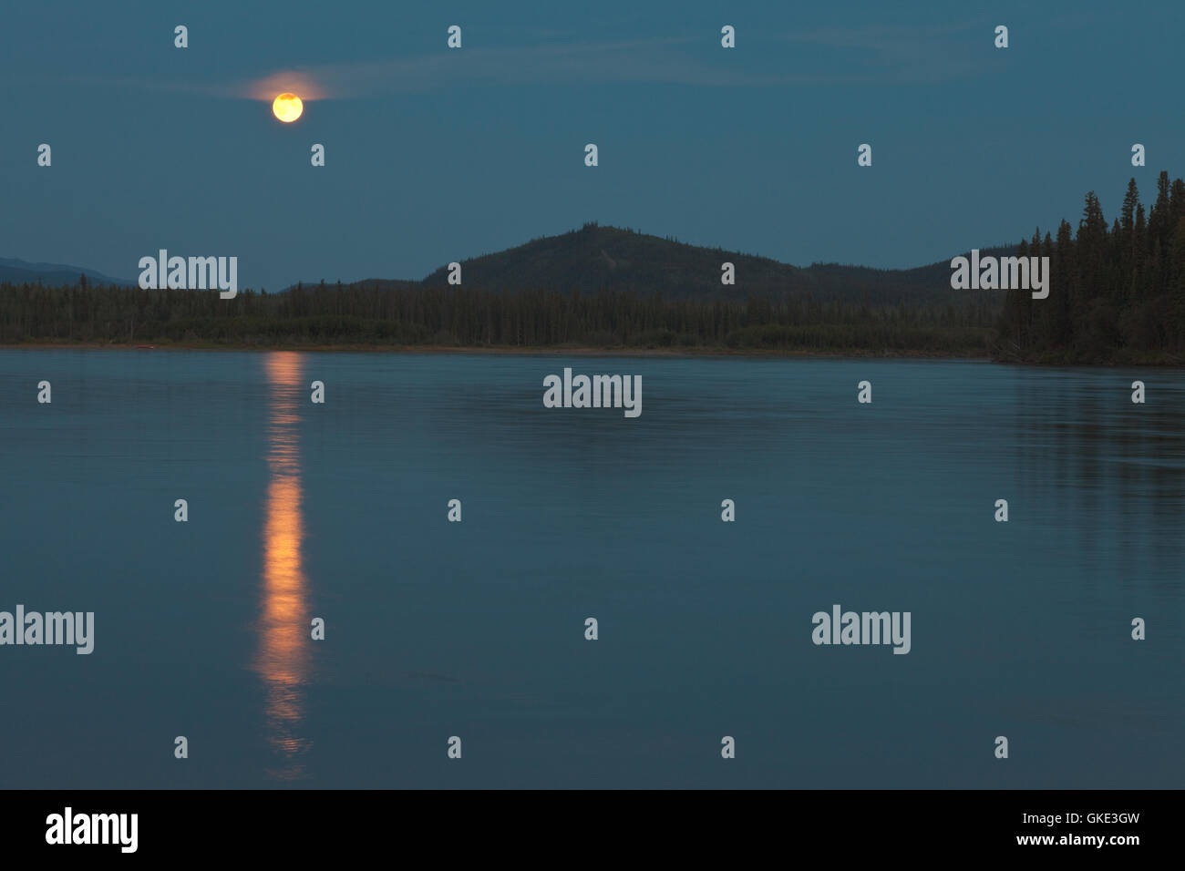Moon over Yukon River Stock Photo - Alamy