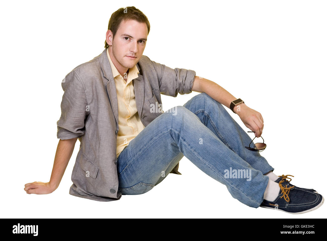 young man sitting Stock Photo - Alamy