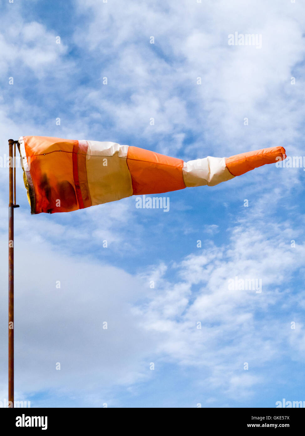 Full wind cone weather vane on windy day Stock Photo - Alamy