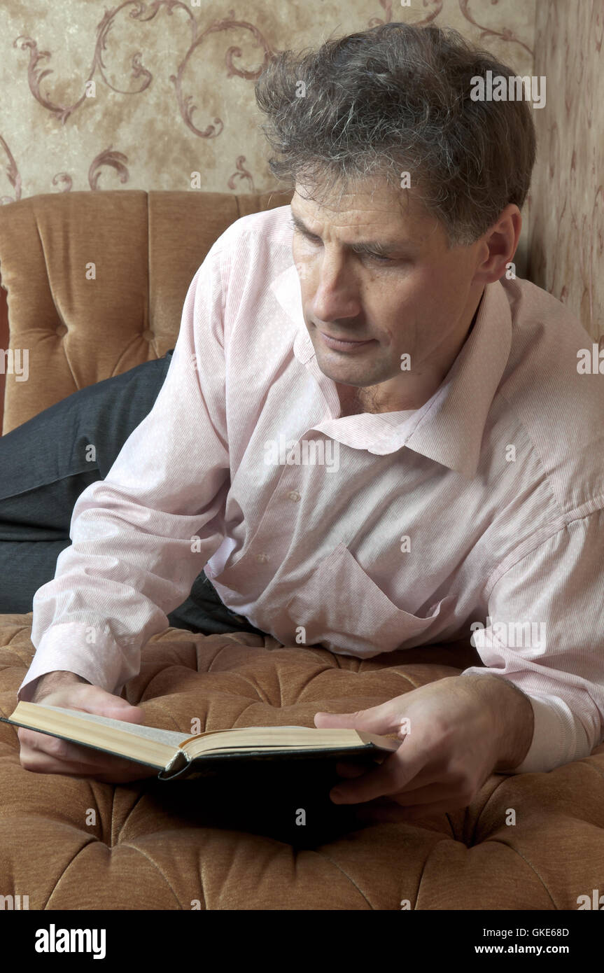 A man with a book Stock Photo - Alamy