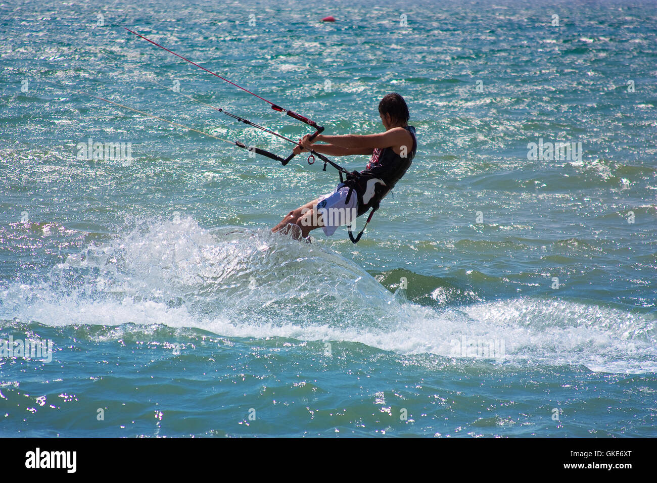 riding the kite in the sea on the waves Stock Photo - Alamy