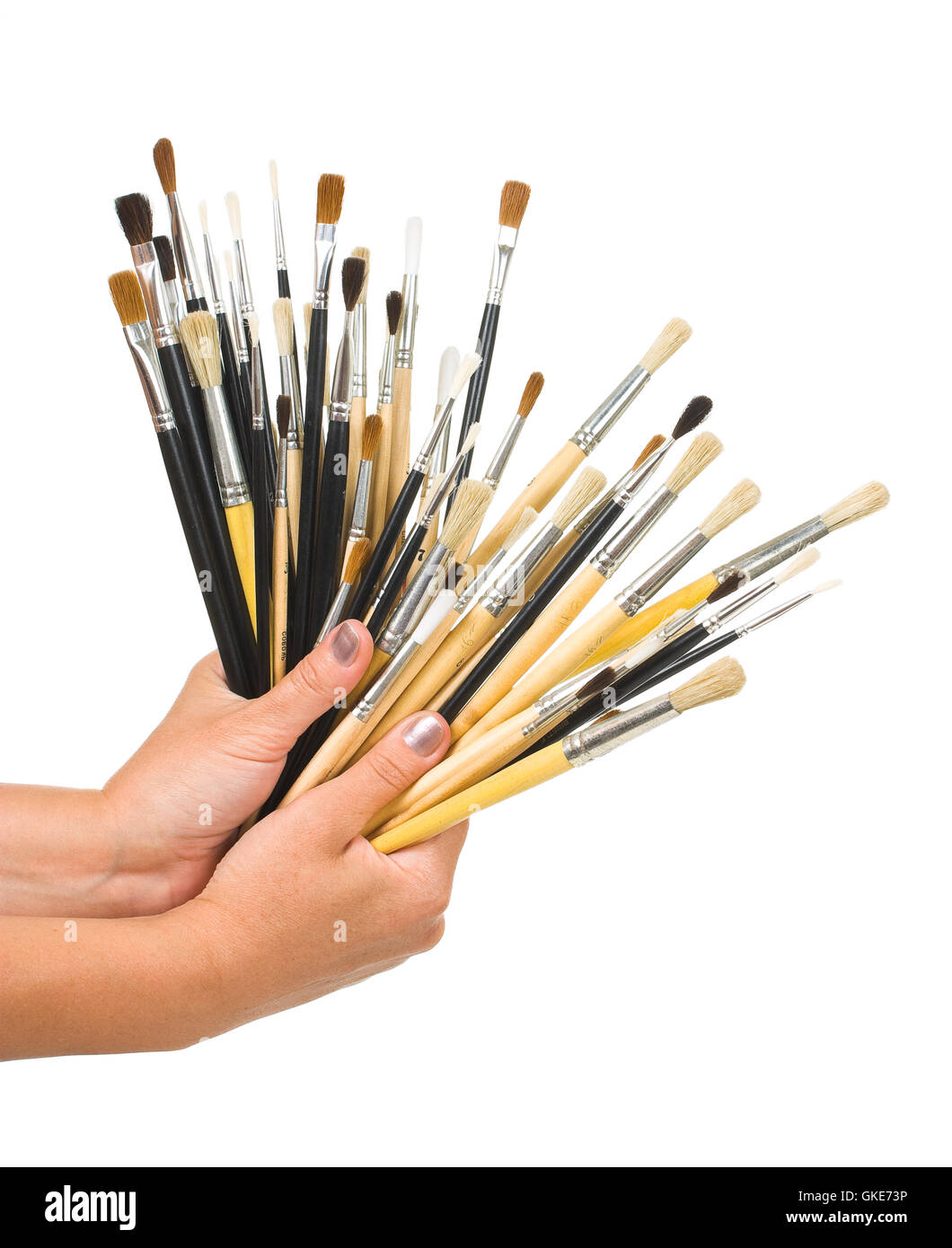 Brushes in hand Stock Photo - Alamy