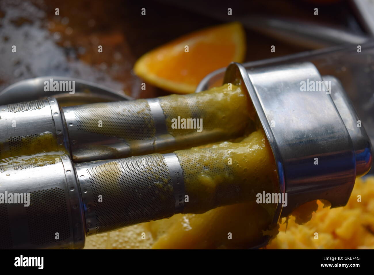 Juicing Machine Making Orange Juice Stock Photo - Alamy
