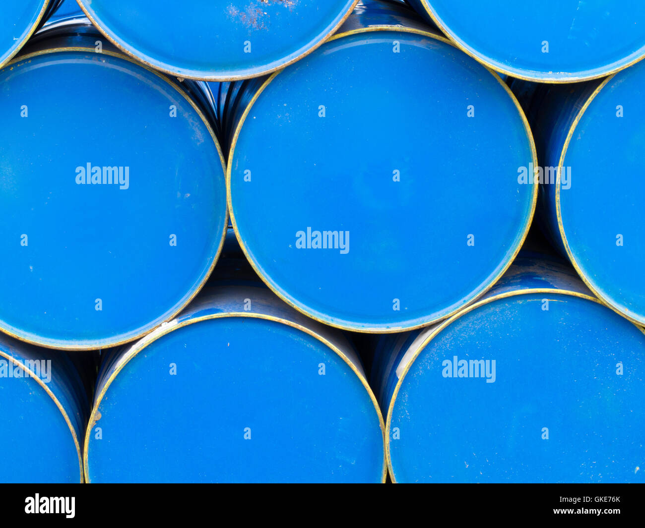 Stack of painted blue oil barrels Stock Photo - Alamy