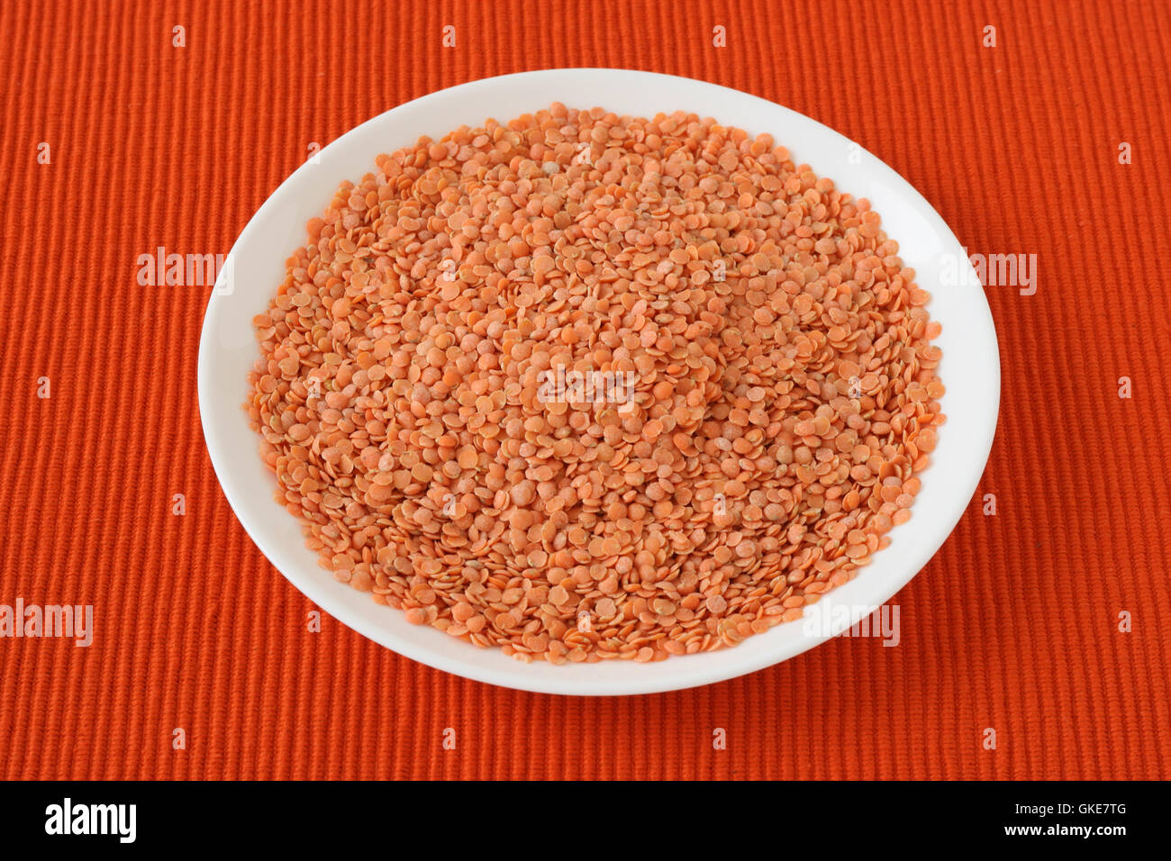 dry red lentil on the plate Stock Photo - Alamy