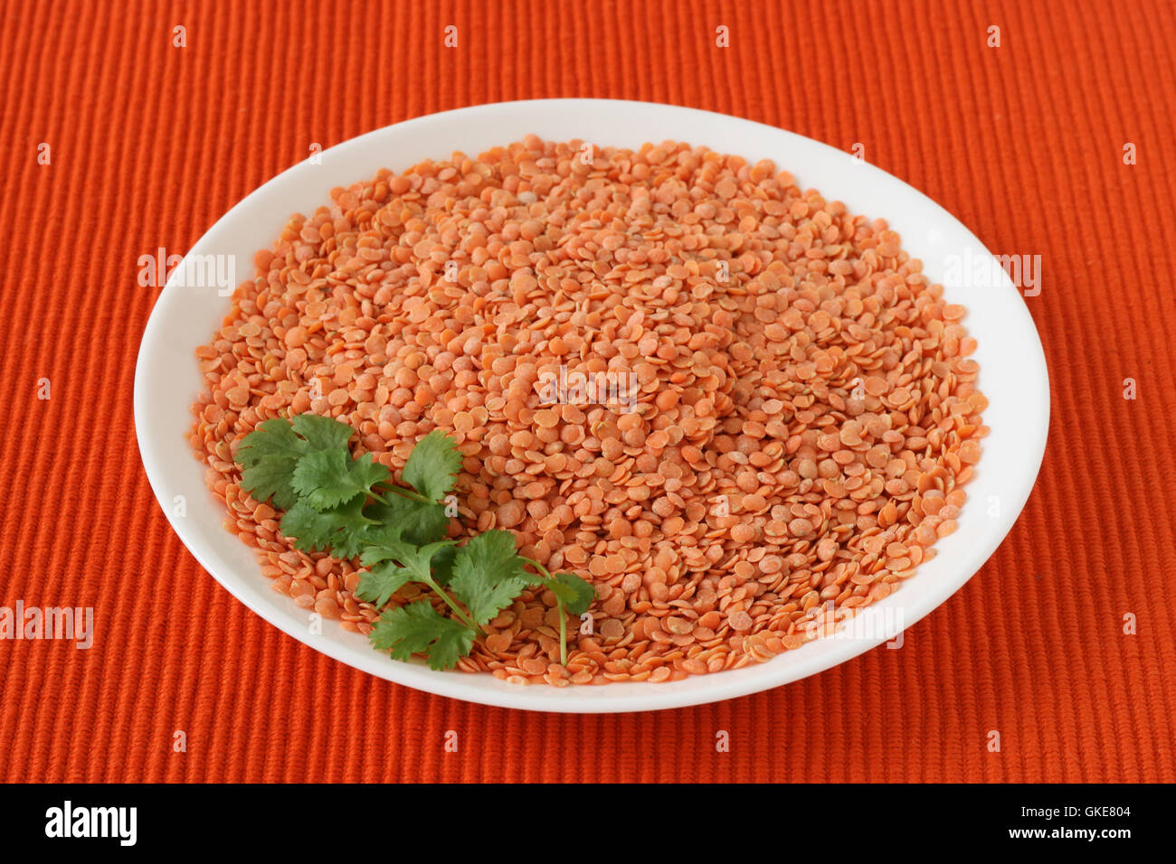 dry red lentil on the plate Stock Photo - Alamy