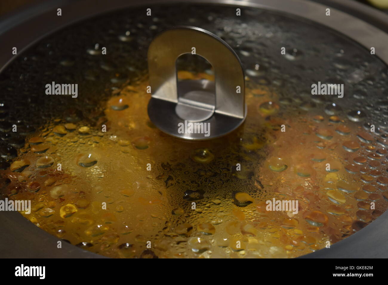 Pot with glass lid closeup to see water steam drops Stock Photo - Alamy