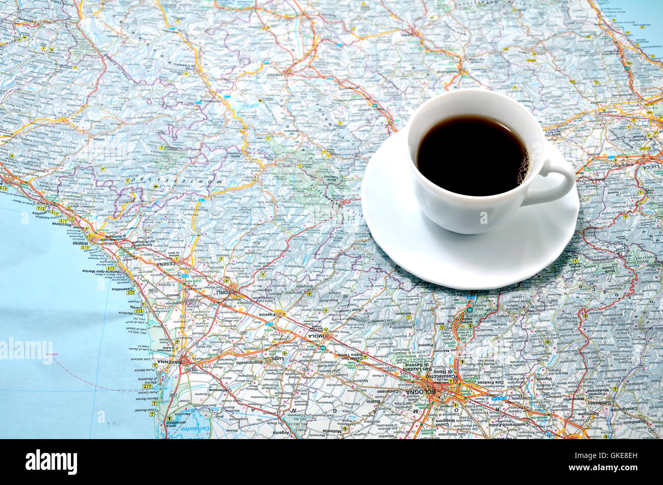 cup of coffee on the map. concept Stock Photo - Alamy
