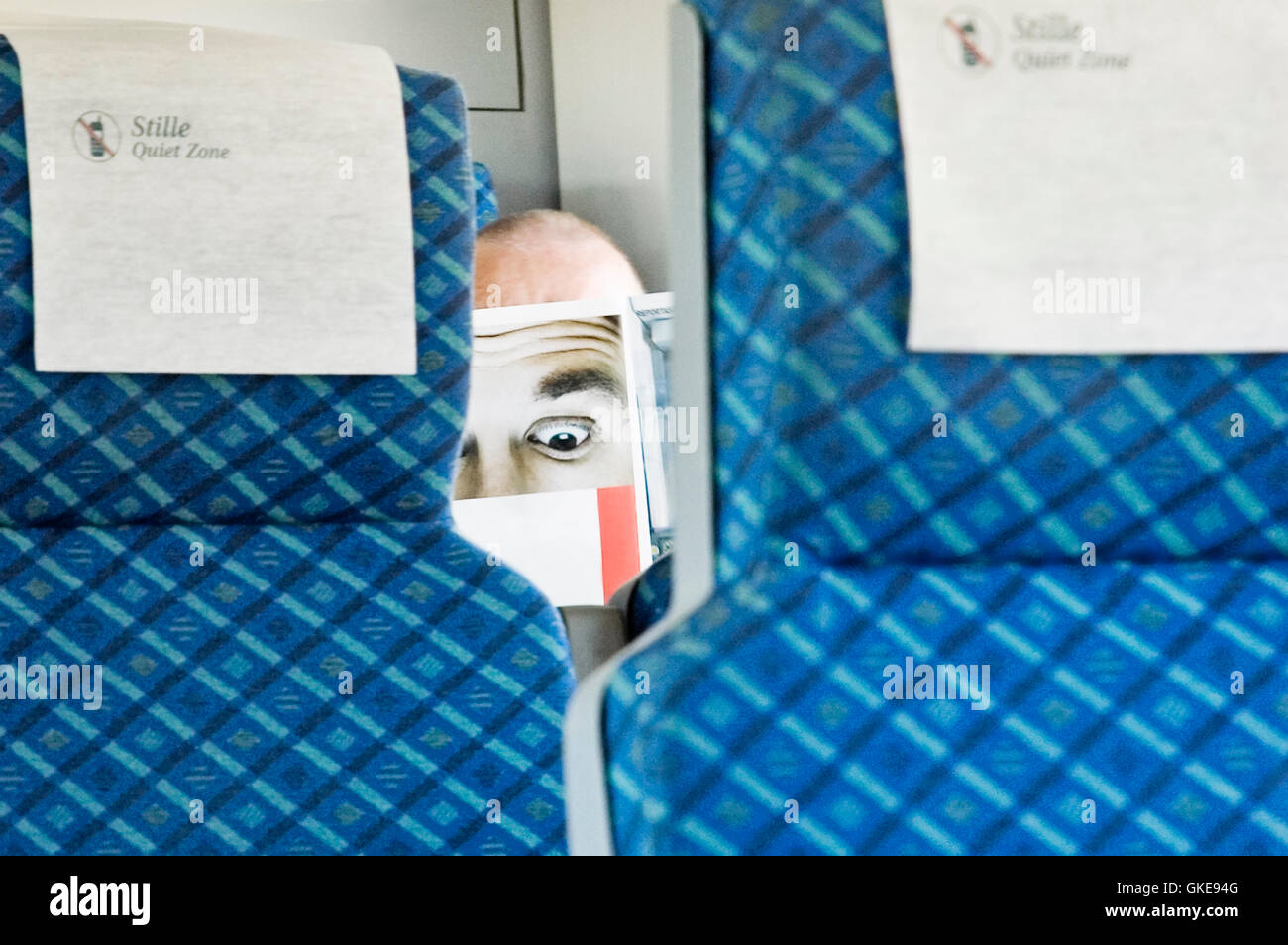 Paper Face Man Reading Paper on Train Stock Photo - Alamy