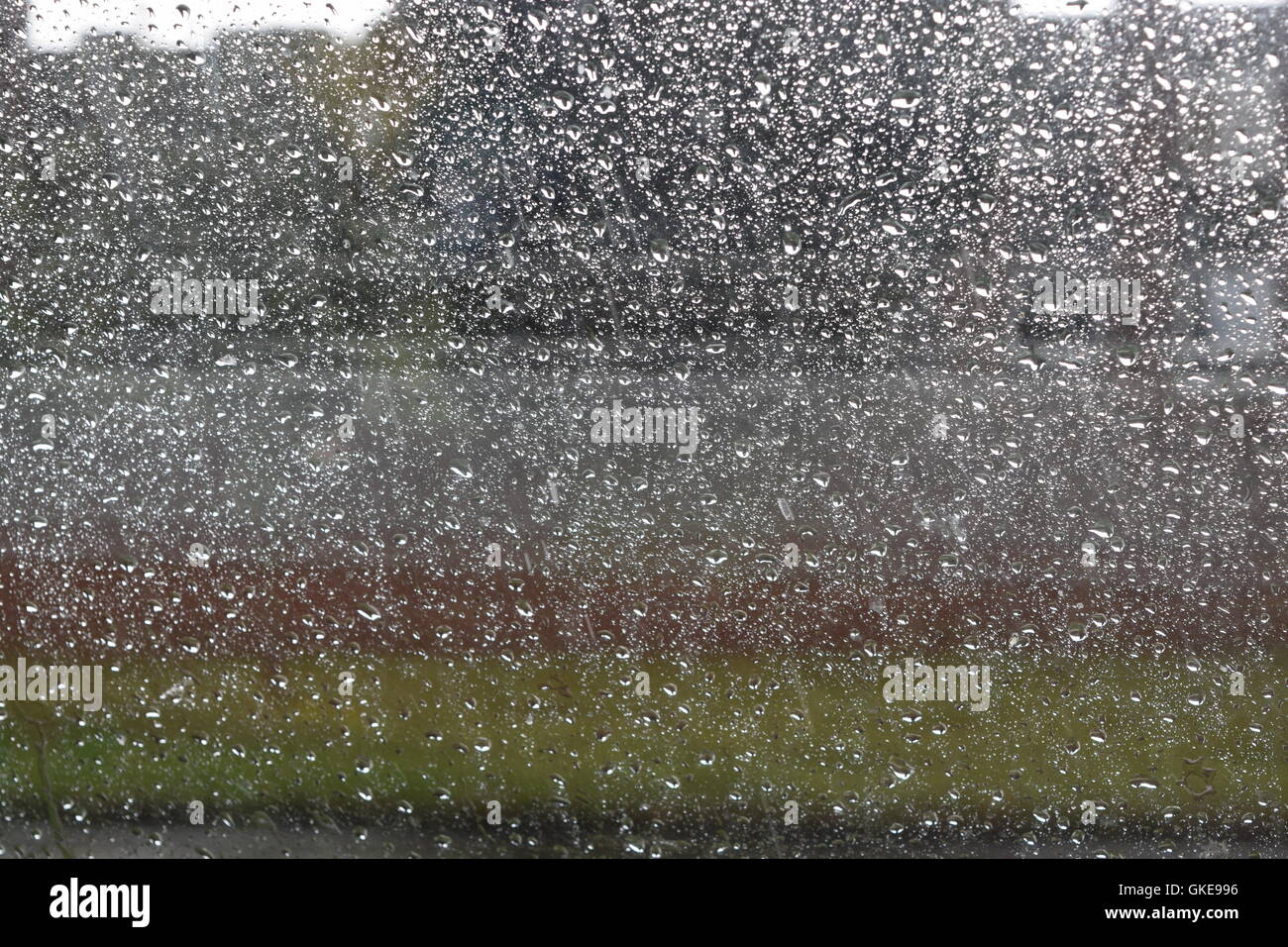 Raindrops on window background Stock Photo - Alamy