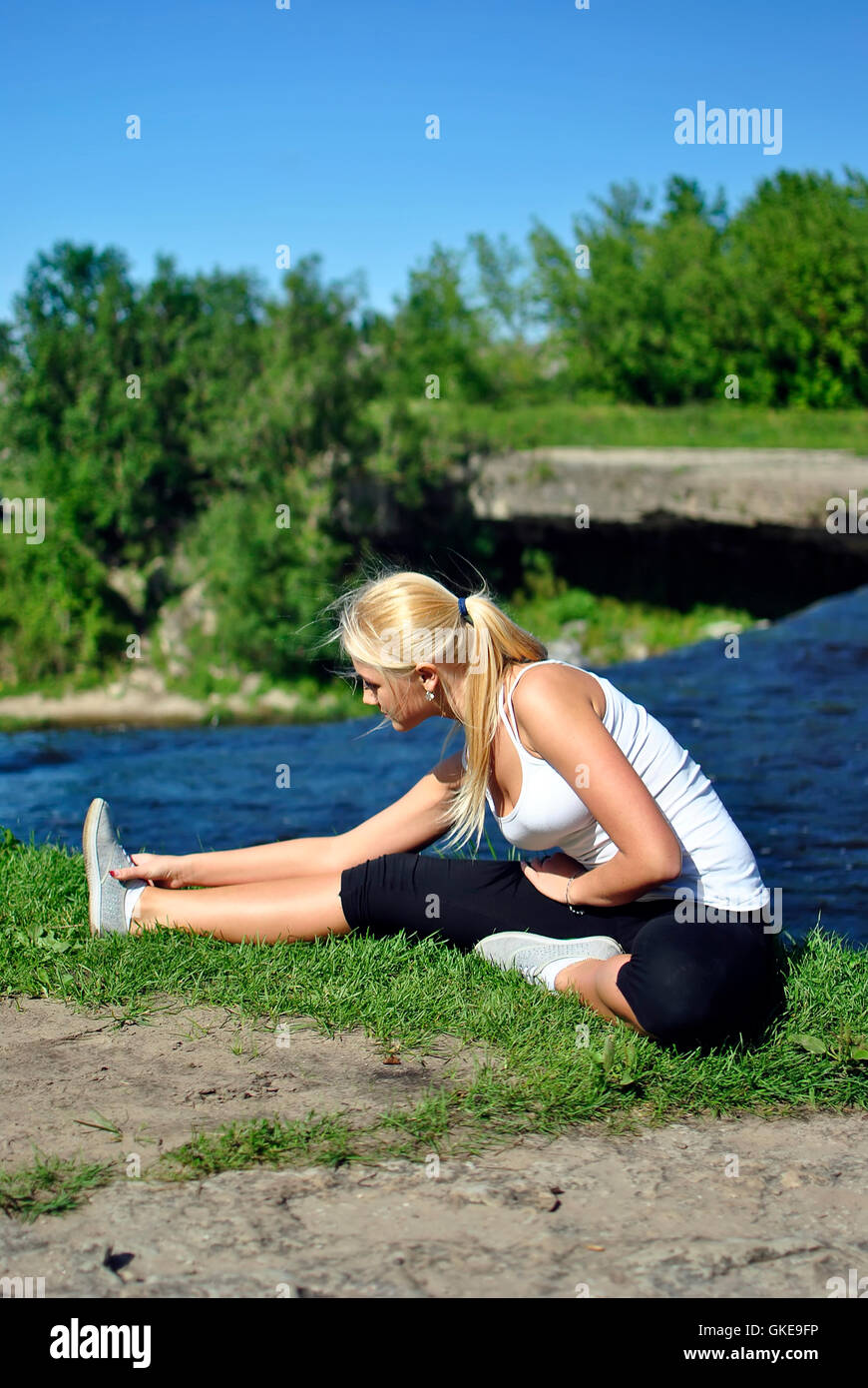 girl doing exercise near a waterfall Stock Photo - Alamy