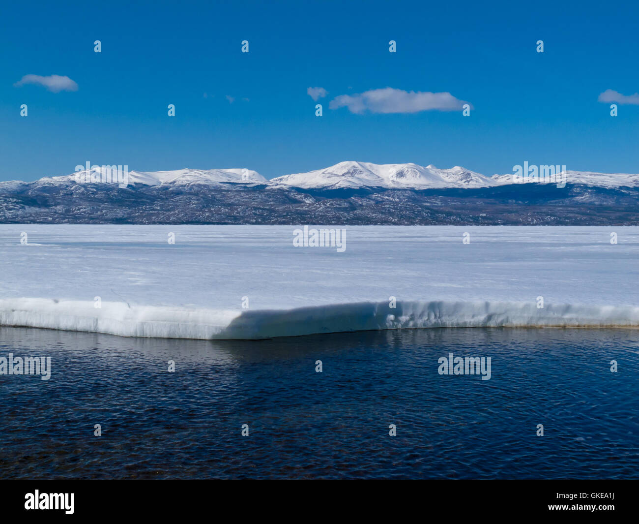 Snowy Mountains at frozen Lake Laberge, Yukon, Canada Stock Photo - Alamy