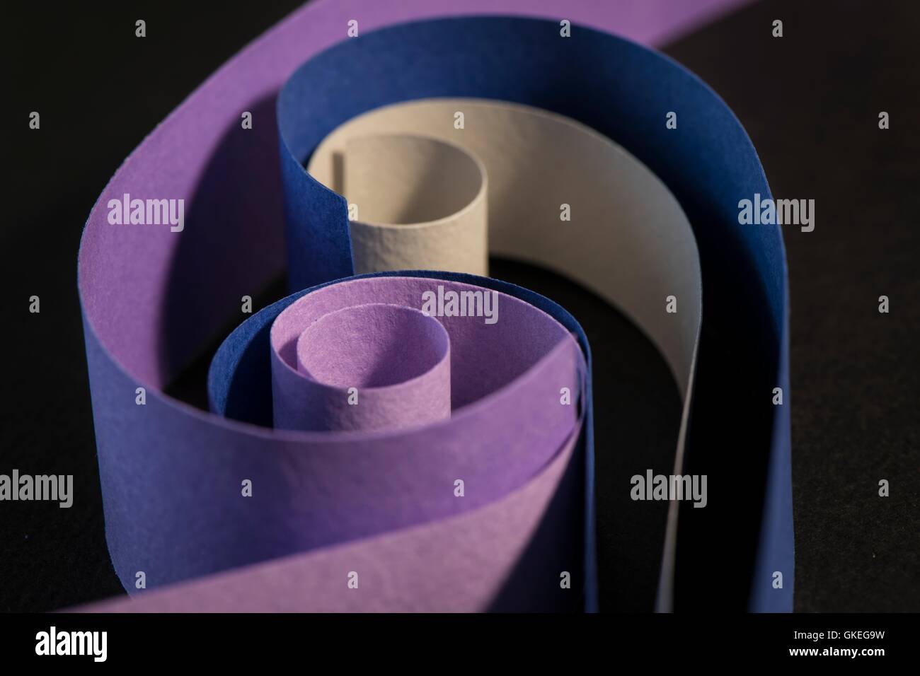 Colourful strips of cardboard as texture and background on black ...