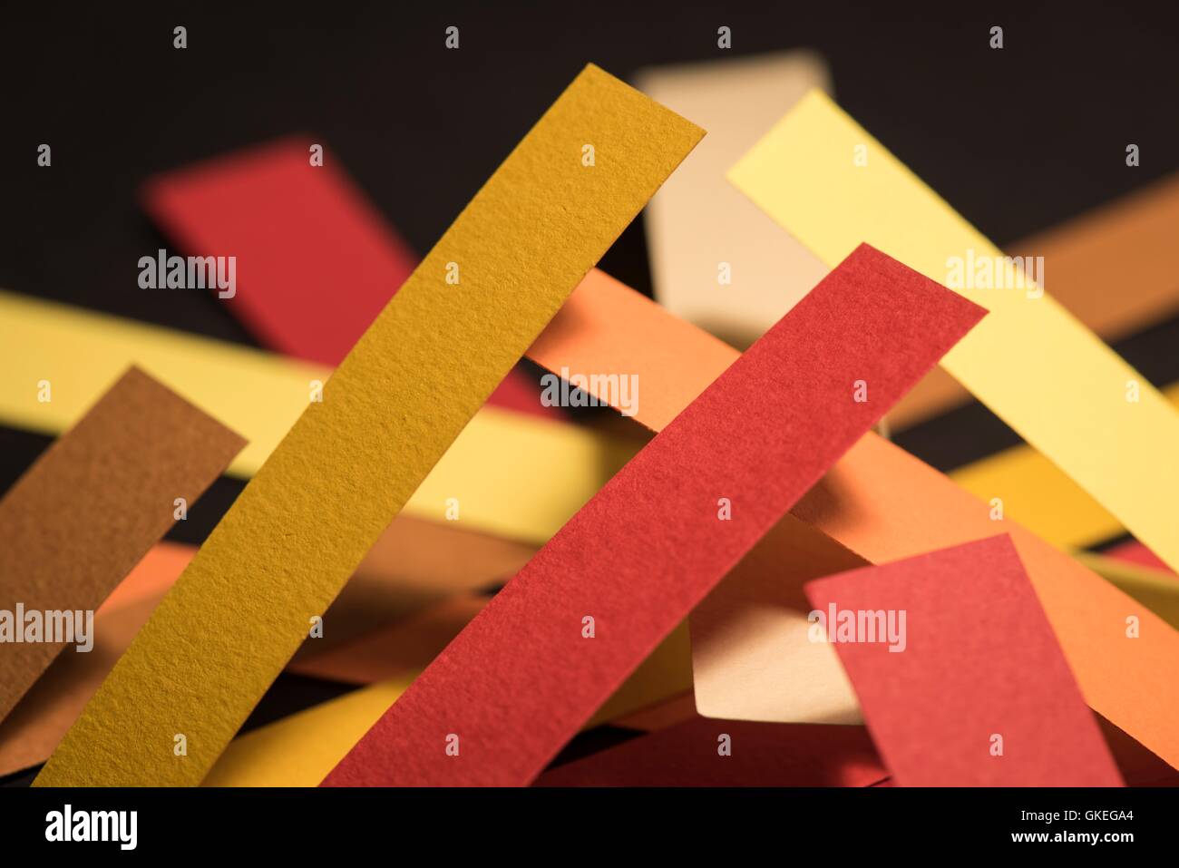 Colourful strips of cardboard as texture and background on black ...