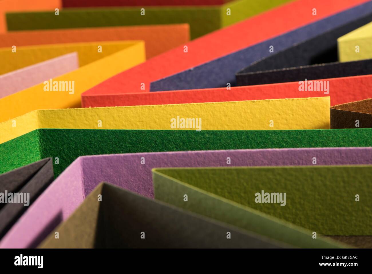 Colourful strips of cardboard as texture and background on black ...