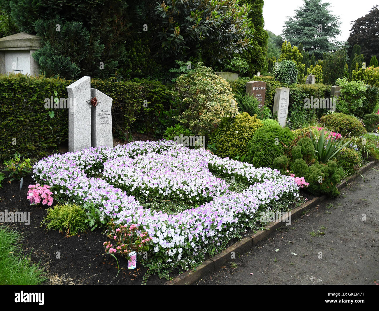 A new gravestone is placed on the grave of Luisa Feldbusch, mother of ...