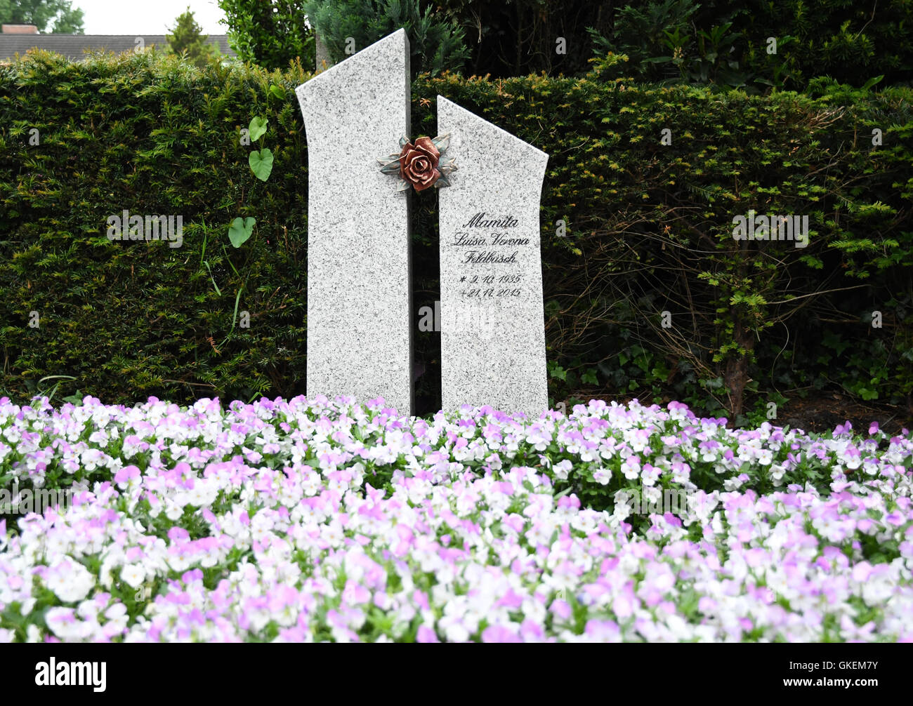 A new gravestone is placed on the grave of Luisa Feldbusch, mother of ...