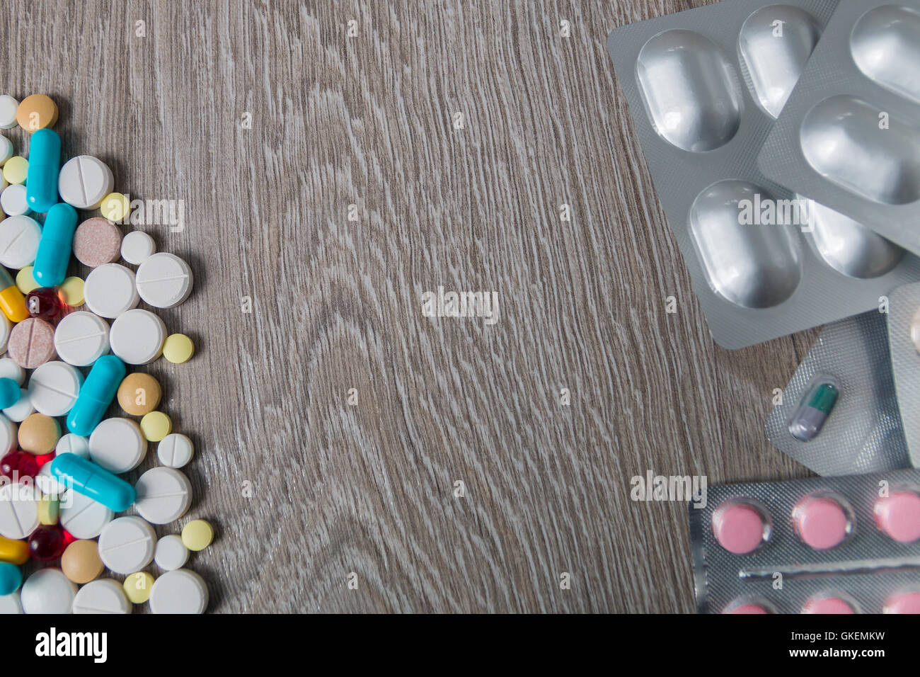 A lot of colorful medication, pills and blister pack from above on grey ...