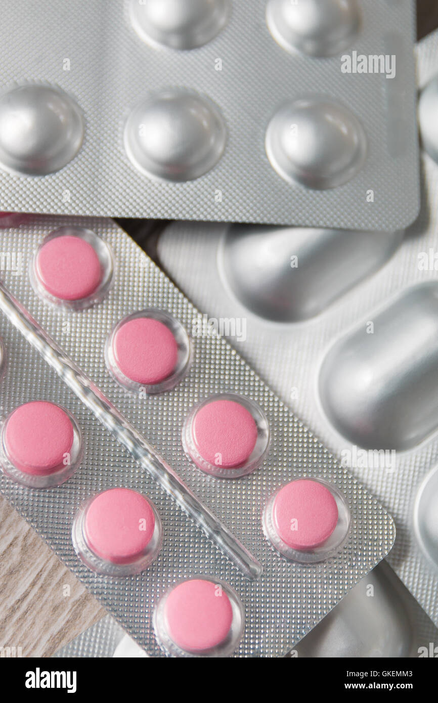 Medication and pills in blister pack from above on grey wooden ...