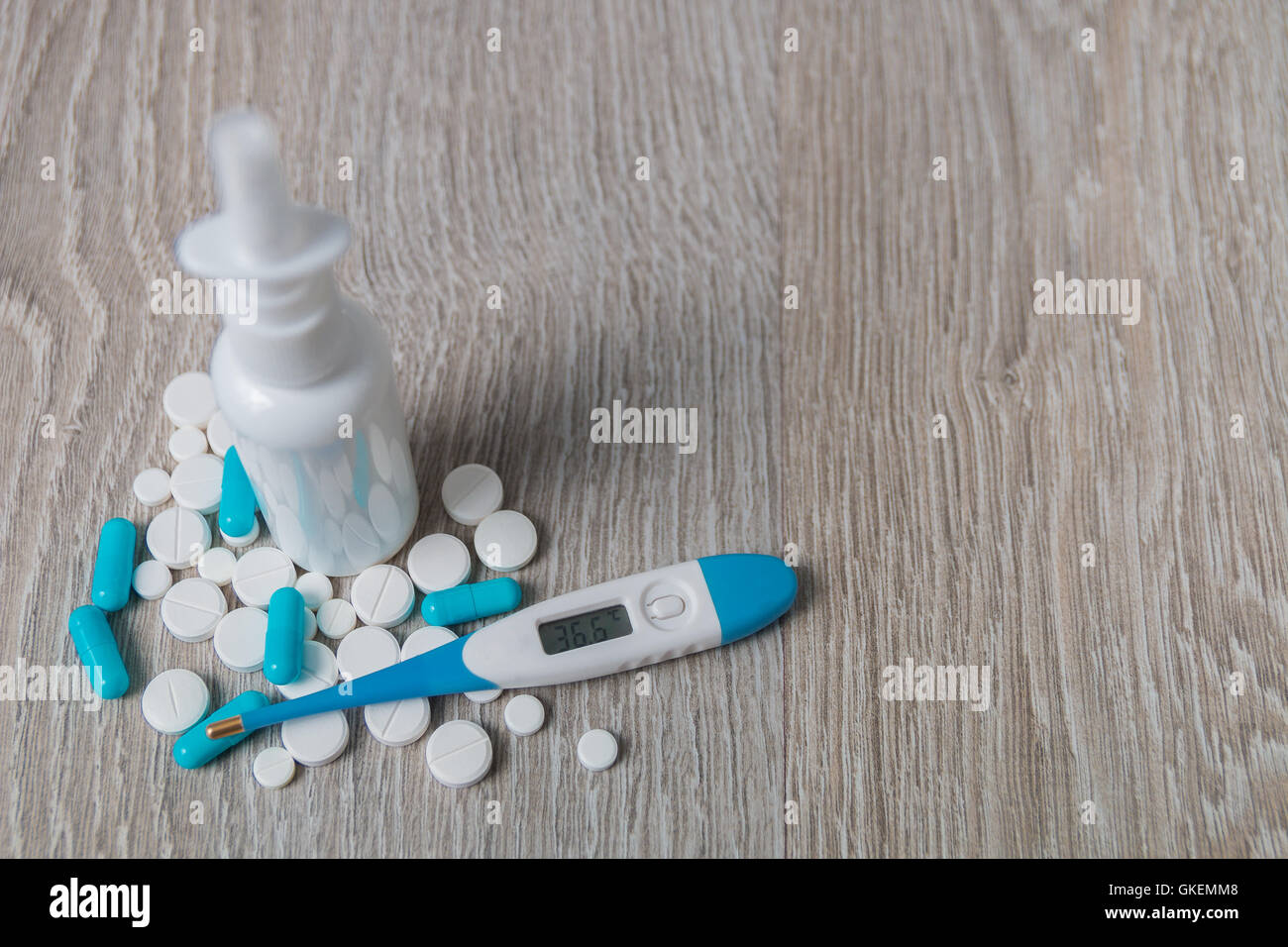 Blue and white medication, nasal spray, pills, vitamins, capsules ...