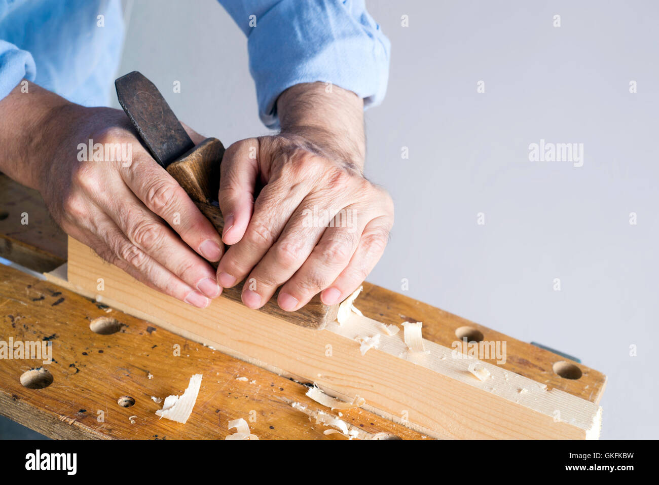 Close up of carpenter working with plane. Copy space Stock Photo - Alamy