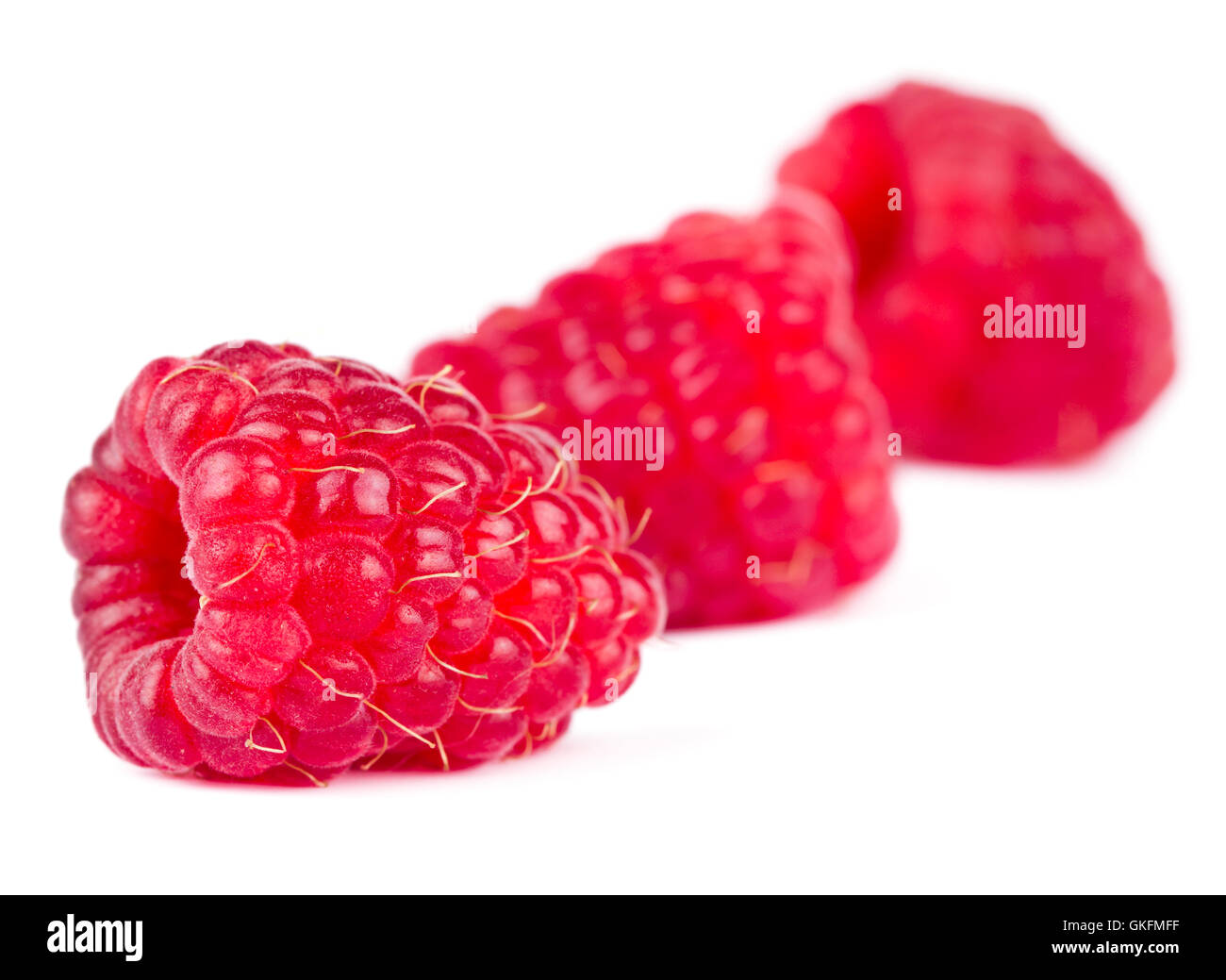 Raspberries on white background Stock Photo - Alamy