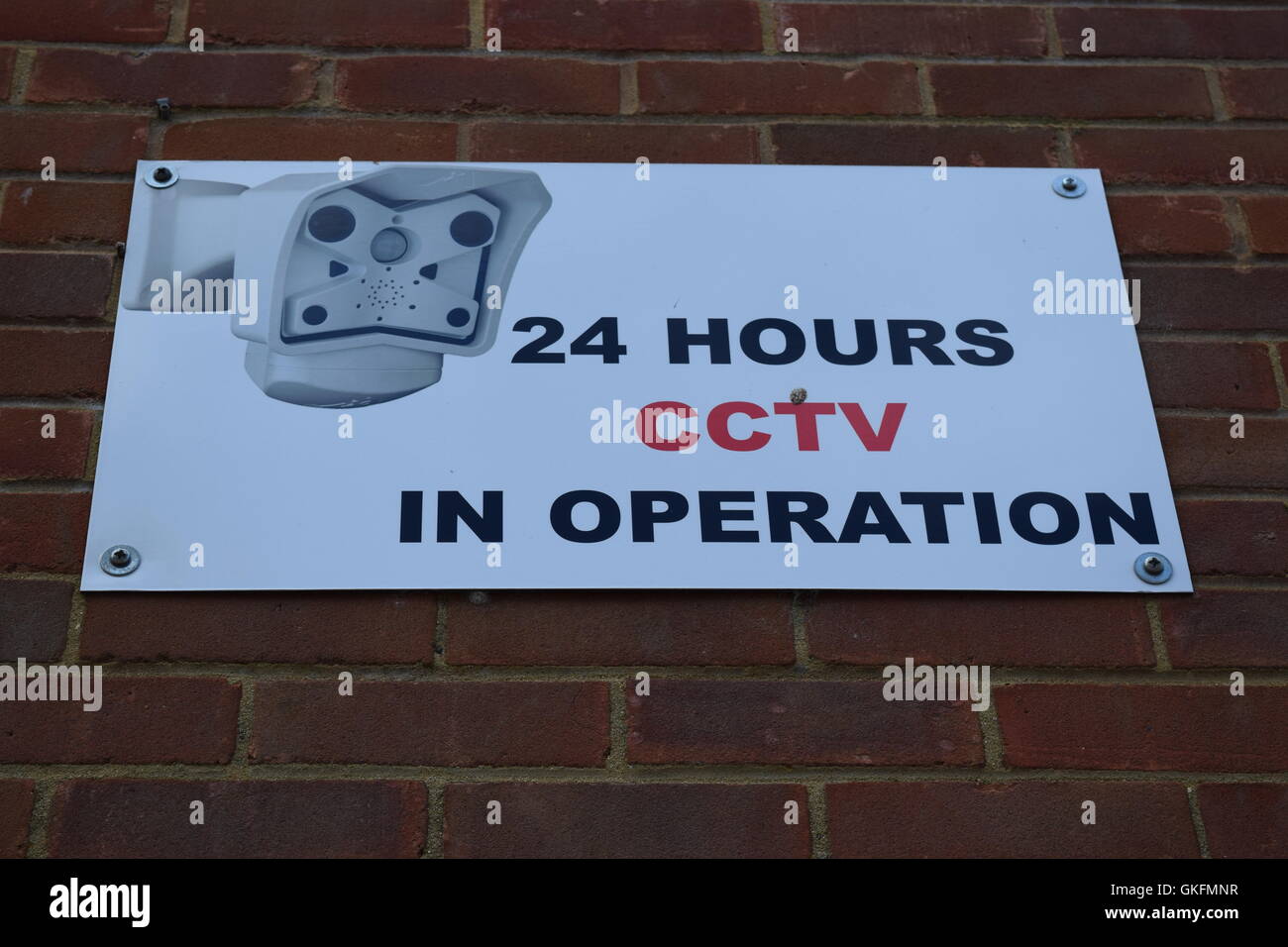 CCTV Sign on a Brick Wall Stock Photo - Alamy
