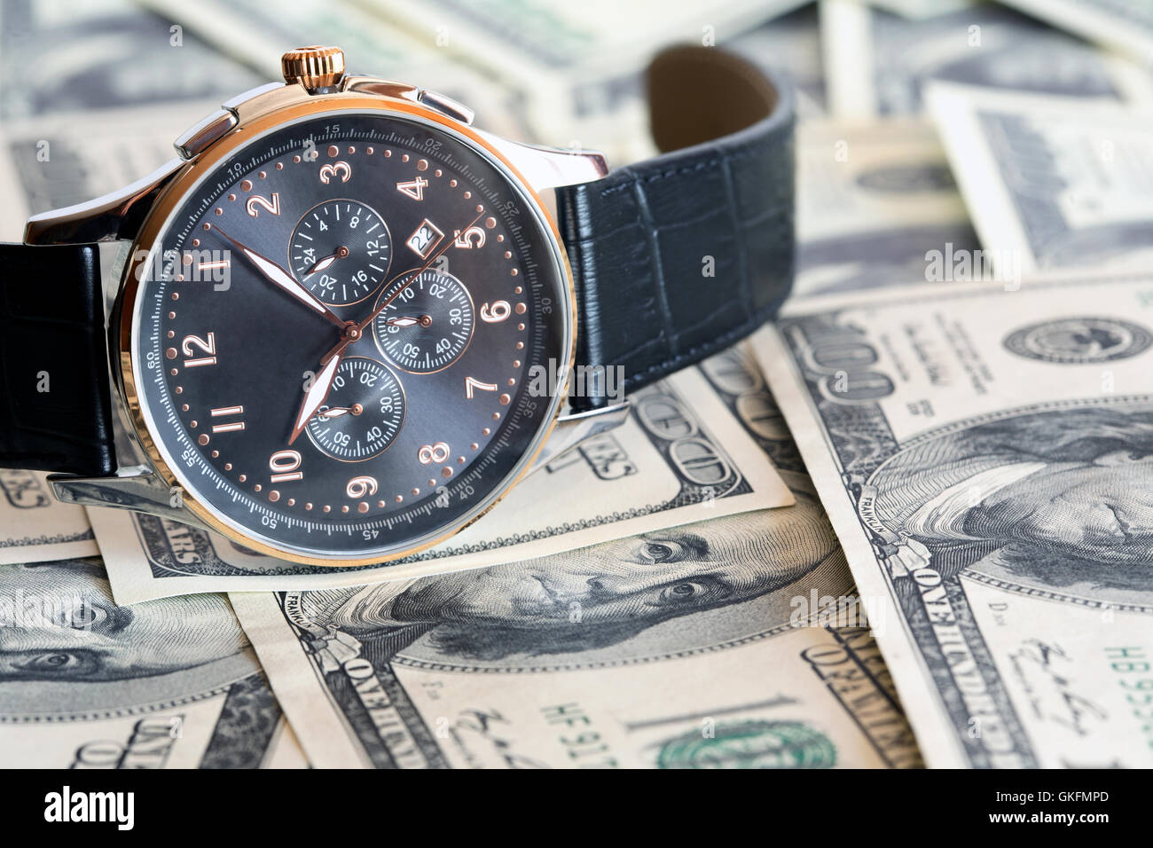 Wristwatch And Money Stock Photo - Alamy
