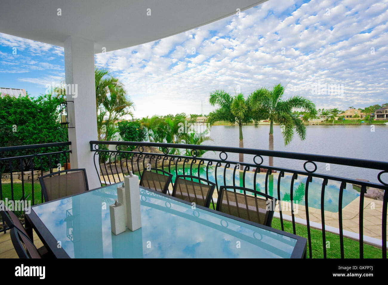 Balcony entertainment area of waterfront house Stock Photo - Alamy