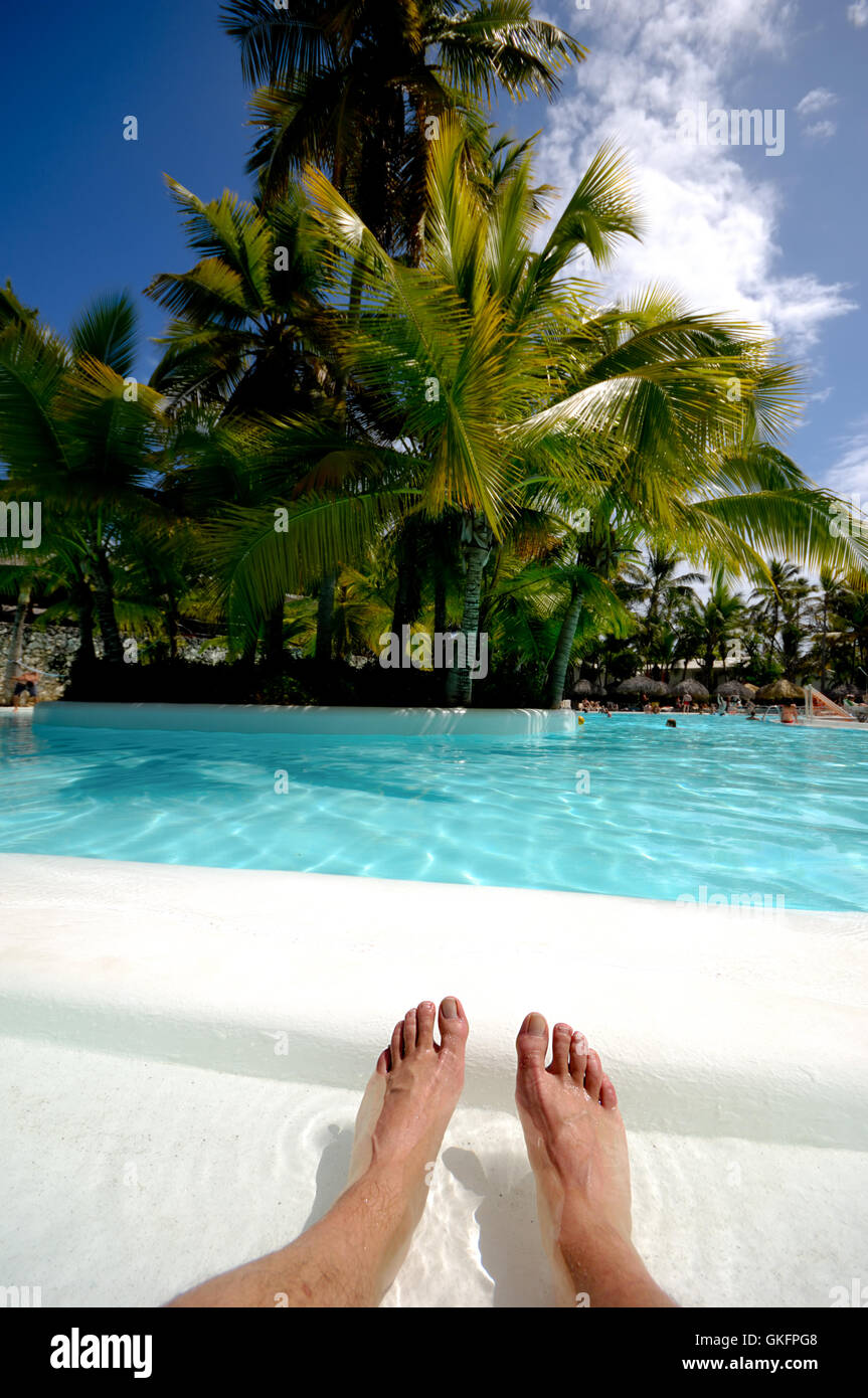 Feet in swimming pool Stock Photo - Alamy