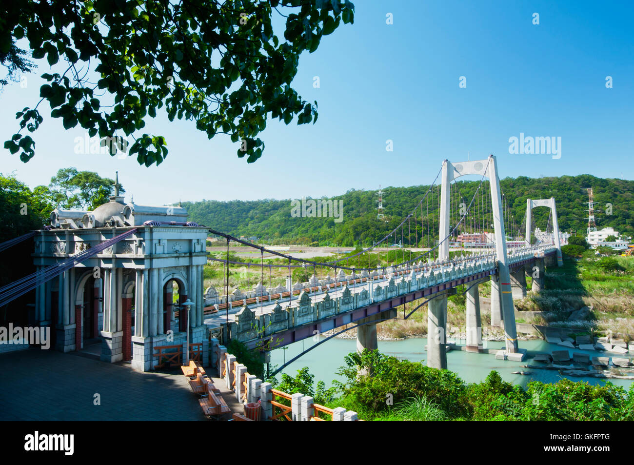 Brick footbridge to green hill Stock Photo - Alamy
