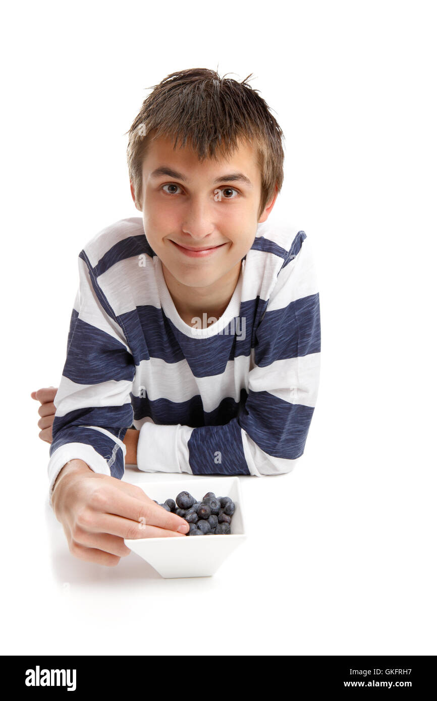 Boy eating blueberries Stock Photo - Alamy