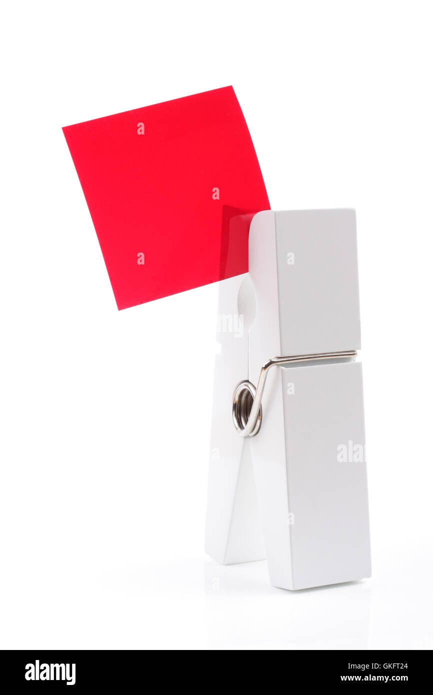 White peg holding red square isolated Stock Photo - Alamy