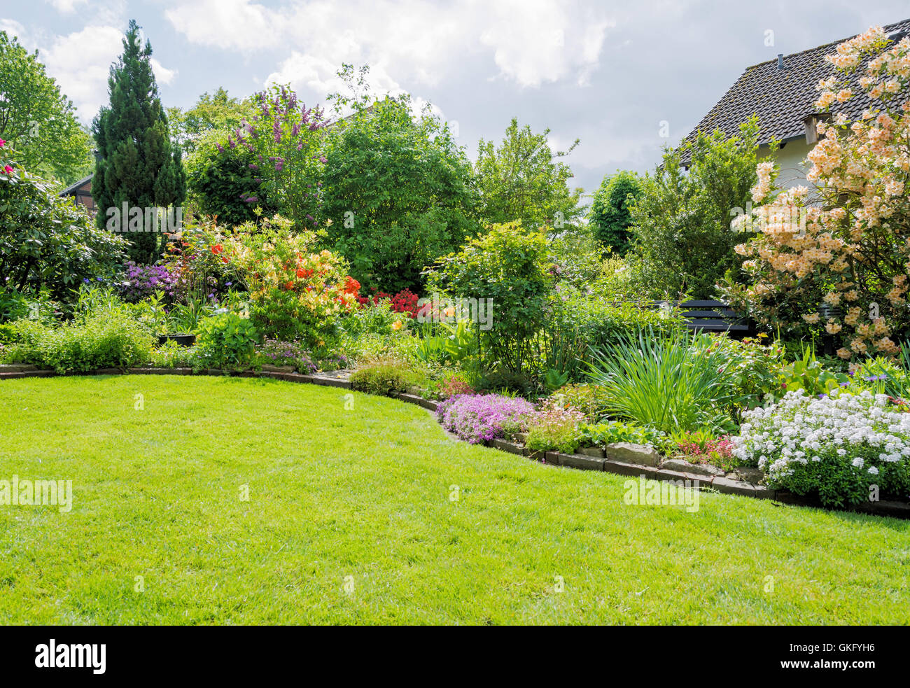 garden with lawn in spring Stock Photo - Alamy