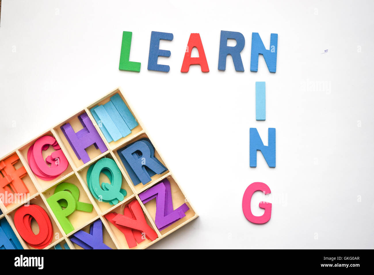 Colorful wooden letter with white background Stock Photo - Alamy