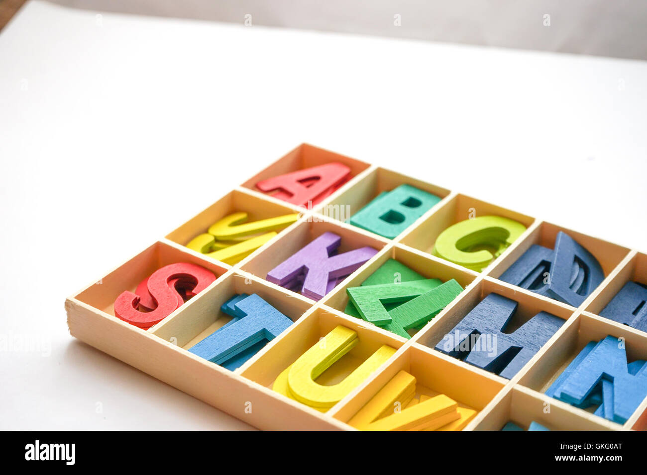 Colorful wooden letter with white background Stock Photo - Alamy