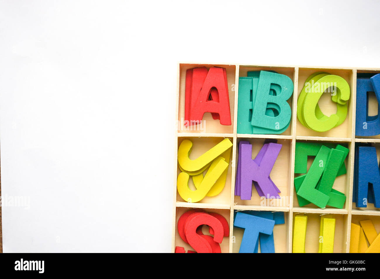 Colorful wooden letter with white background Stock Photo - Alamy