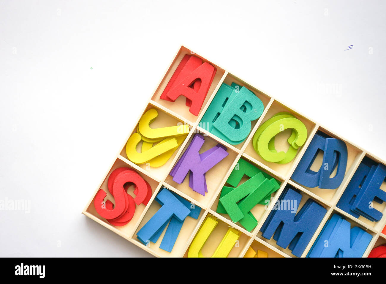 Colorful wooden letter with white background Stock Photo - Alamy