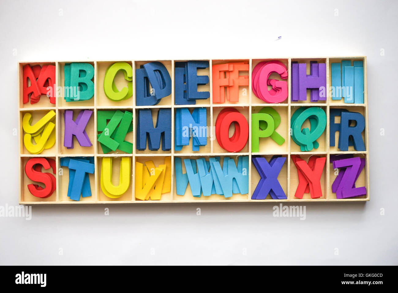 Colorful wooden letter with white background Stock Photo - Alamy