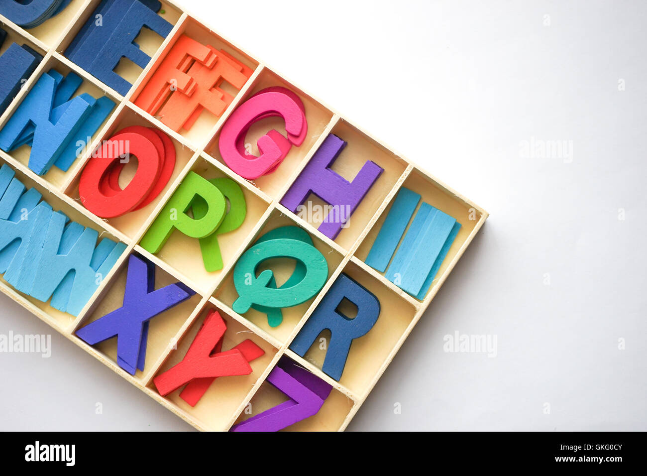 Colorful wooden letter with white background Stock Photo - Alamy
